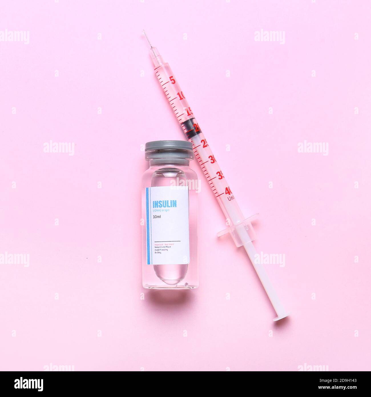 Bottle of insulin with syringe on color background. Diabetes concept ...