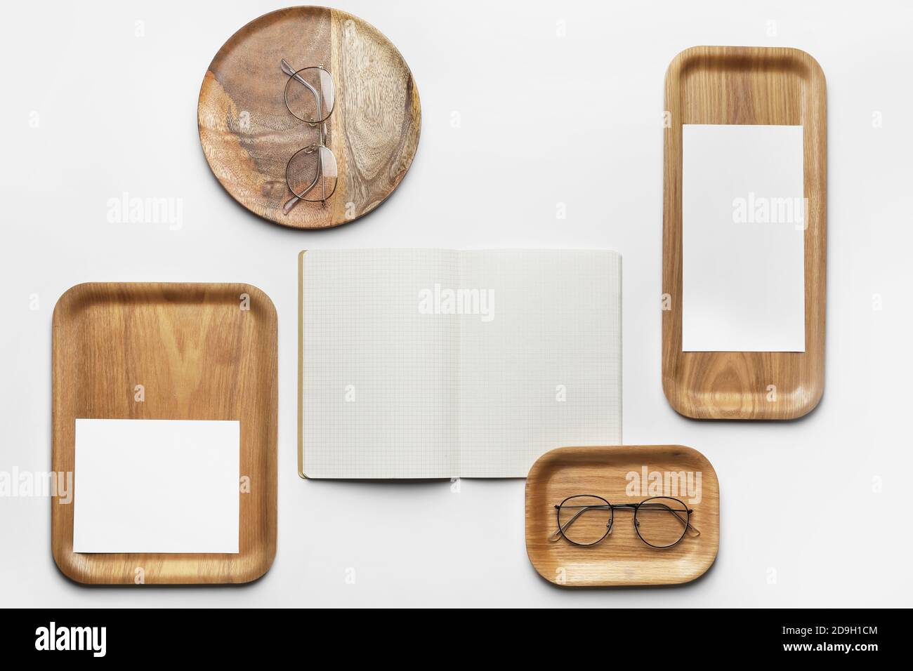 Composition with empty notebook and plates on white background Stock ...