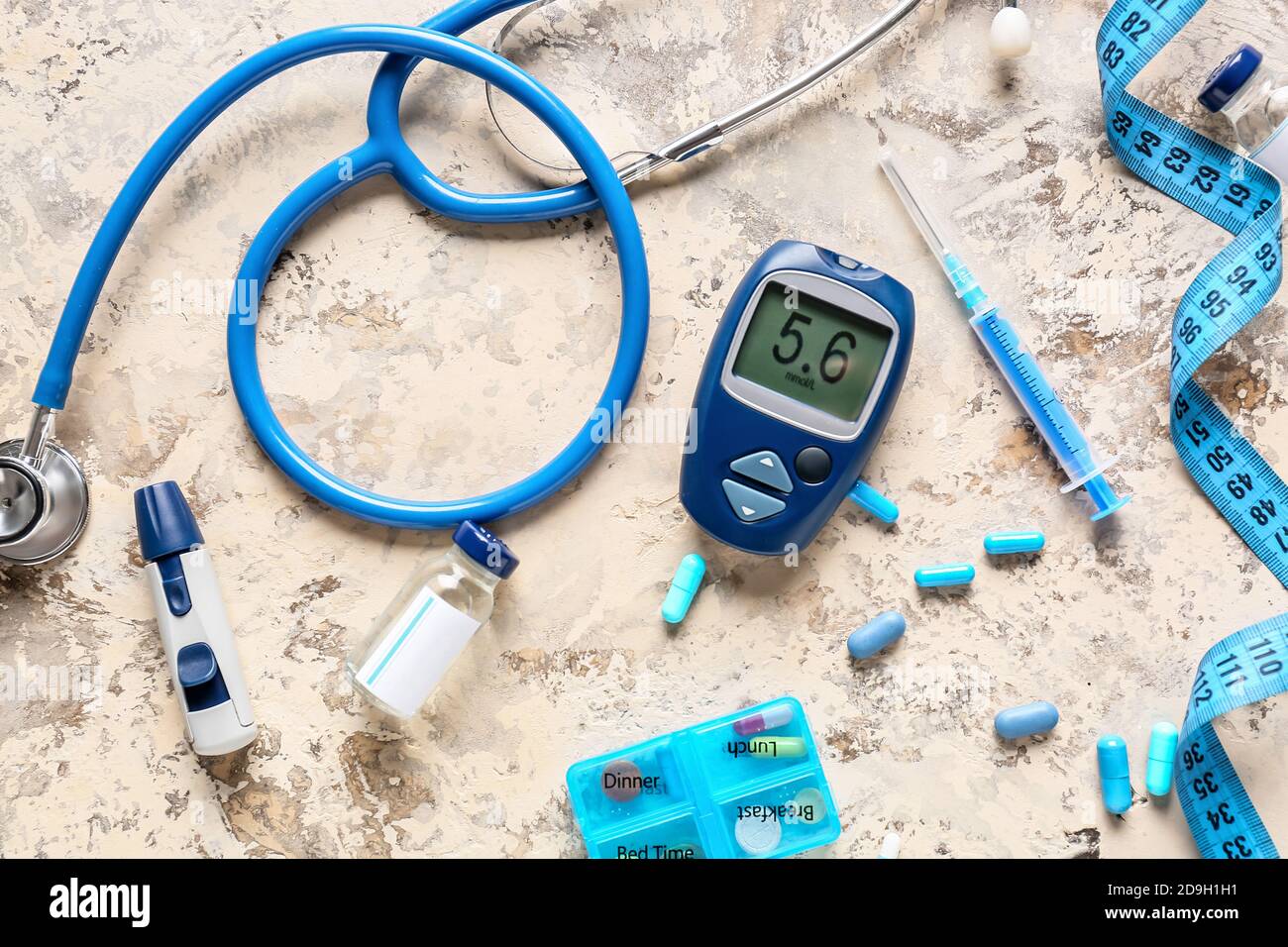 Glucometer with lancet pen, syringe, measuring tape, stethoscope and ...