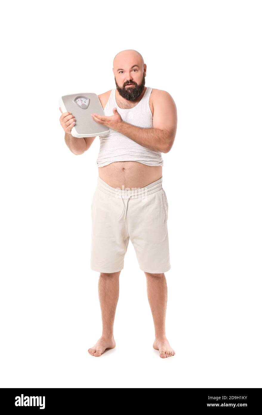 Overweight man with scales on white background. Weight loss concept ...