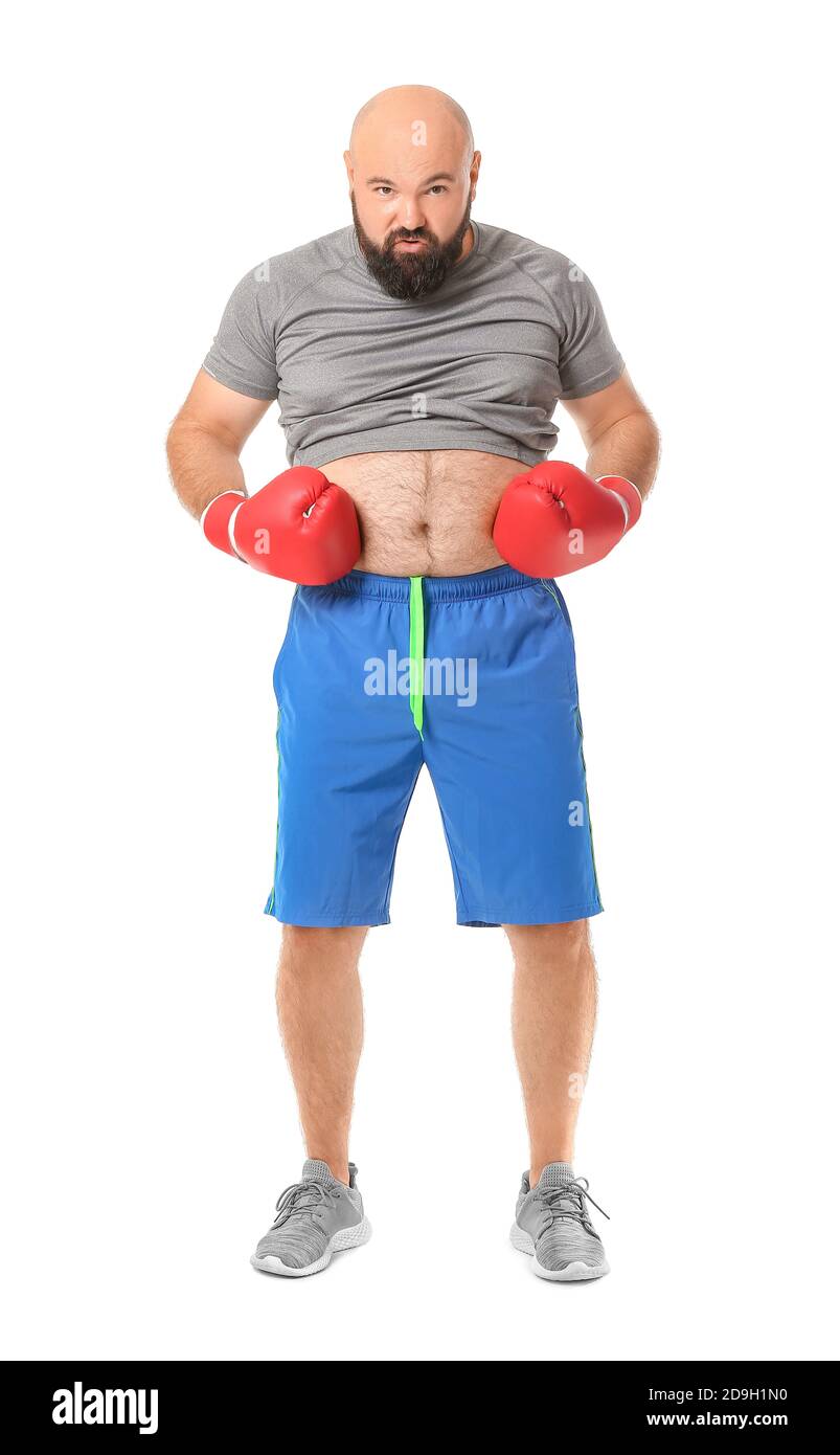 Overweight man in boxing gloves on white background. Weight loss ...