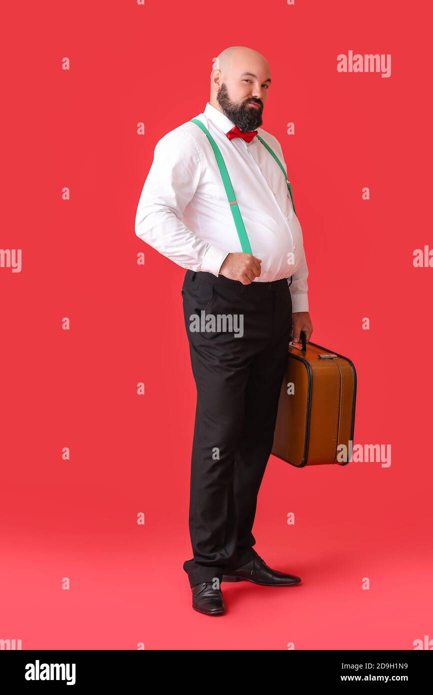 Overweight businessman on color background Stock Photo - Alamy