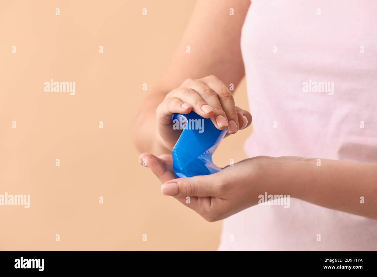 Woman crumpling plastic cup on color background. Ecology concept Stock ...