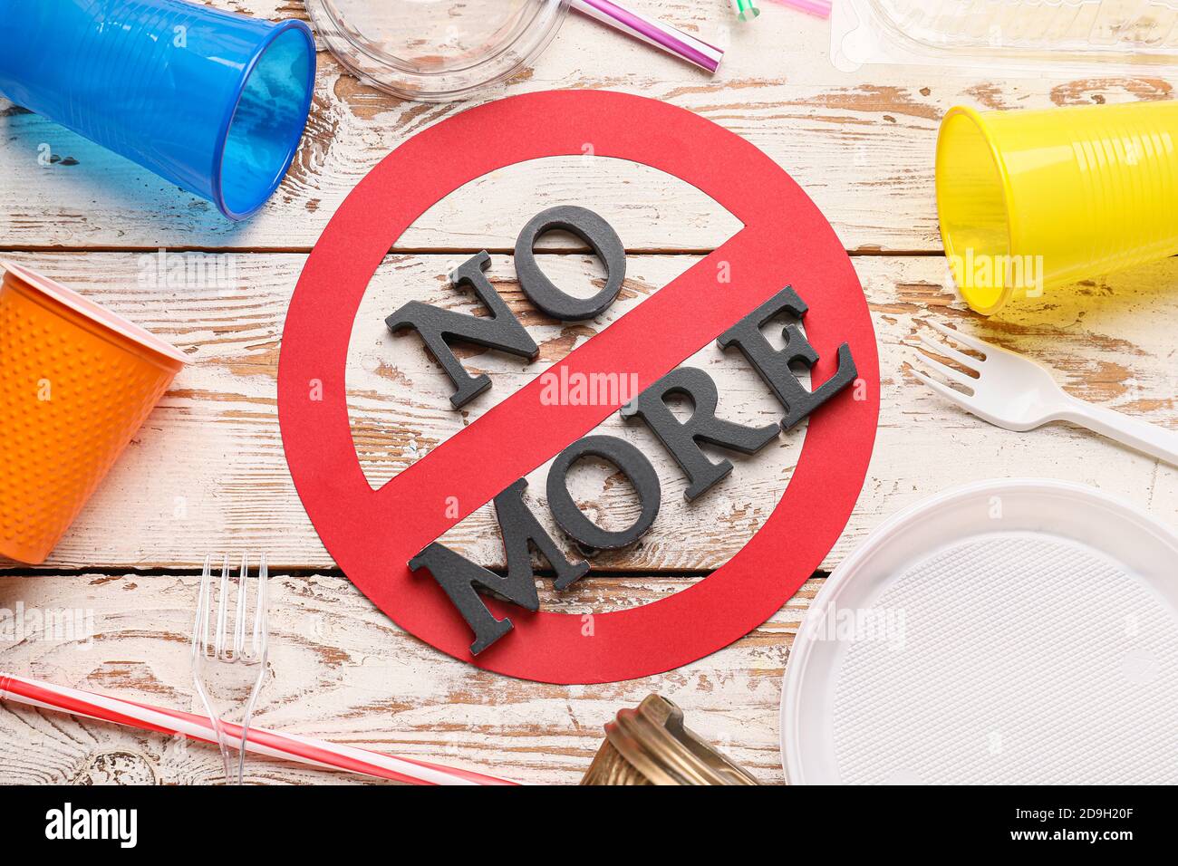 Plastic garbage, stop sign and text NO MORE on wooden background ...