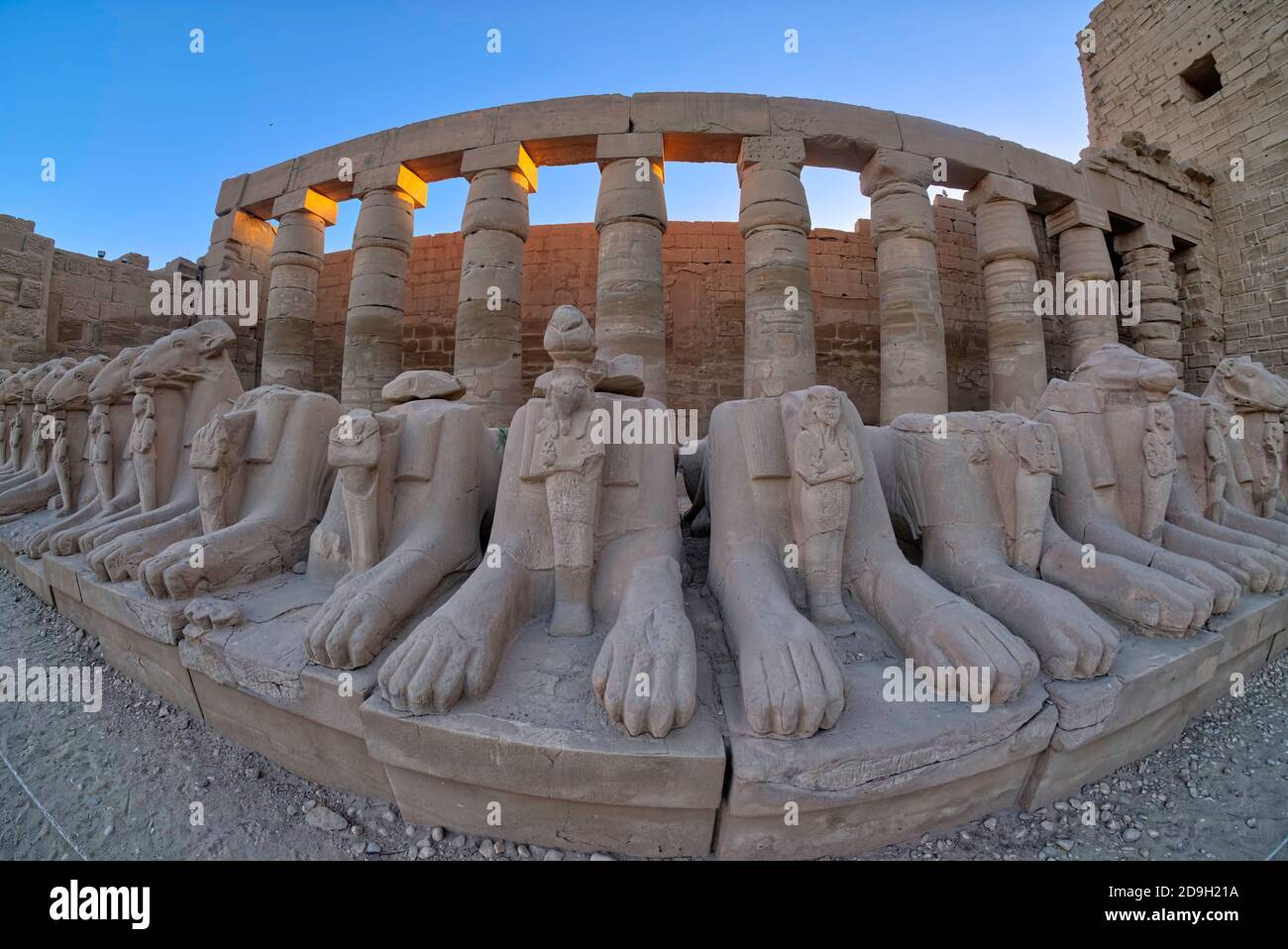Avenue of sphinxes leading to the main temple precinct at the ruins of ...