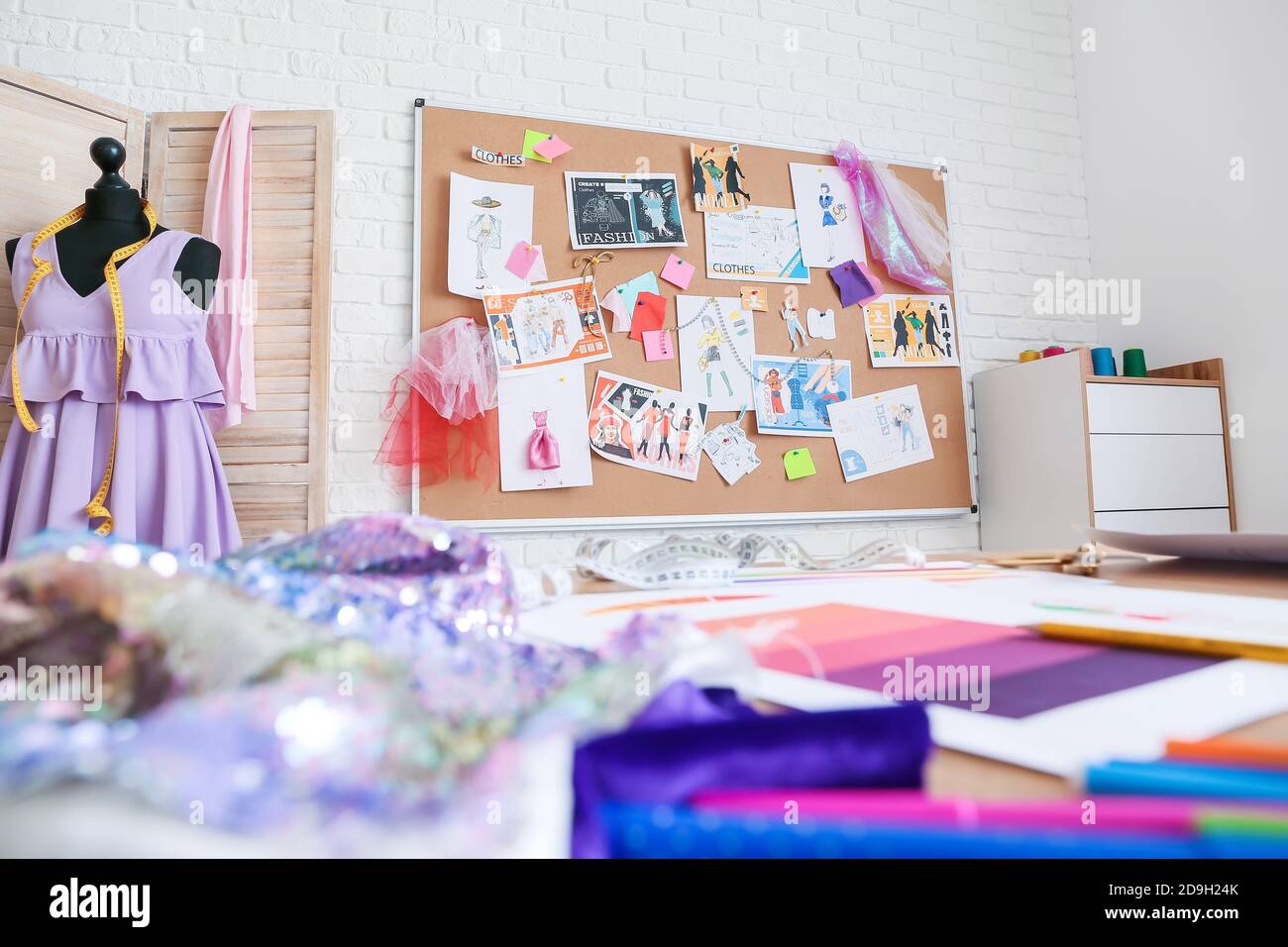 Workplace in studio of fashion designer Stock Photo - Alamy