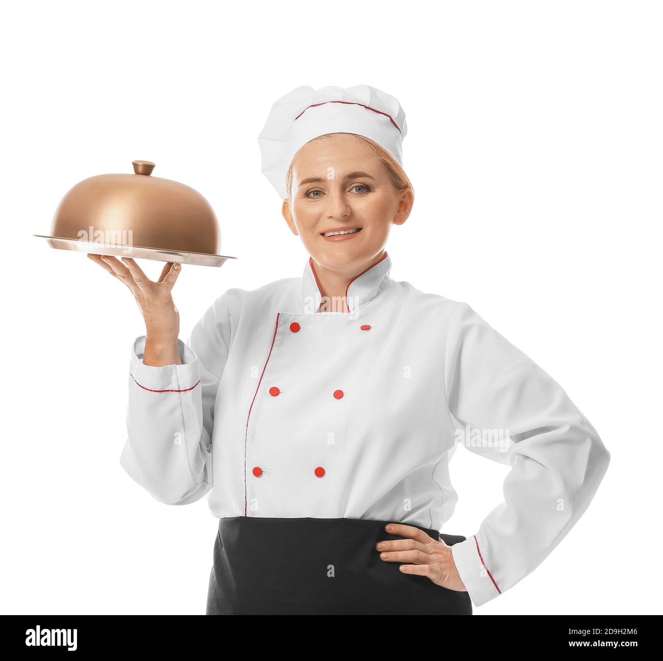 Mature female chef with tray and cloche on white background Stock Photo ...
