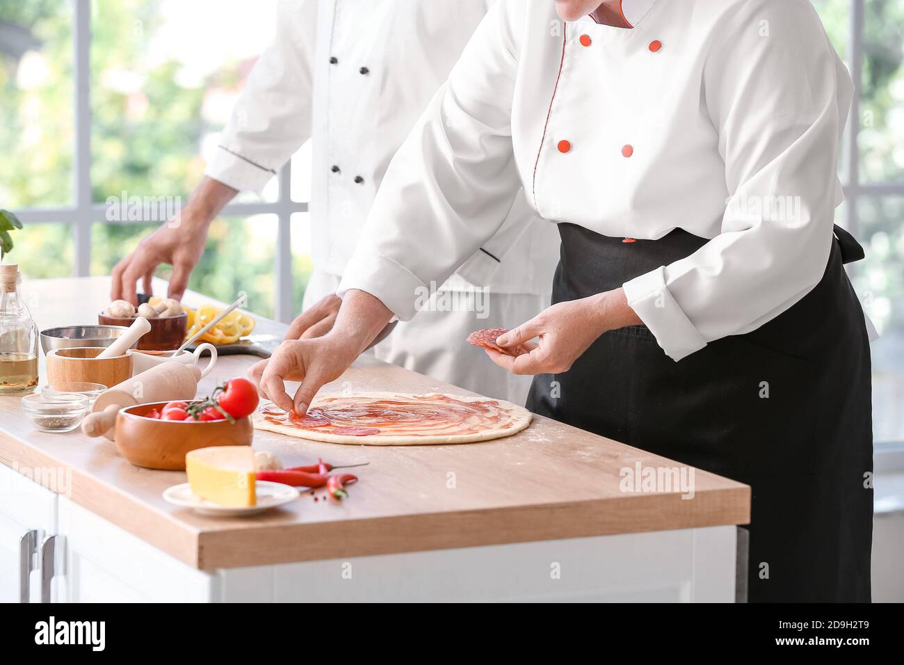 Chefs cooking tasty pizza hi-res stock photography and images - Alamy