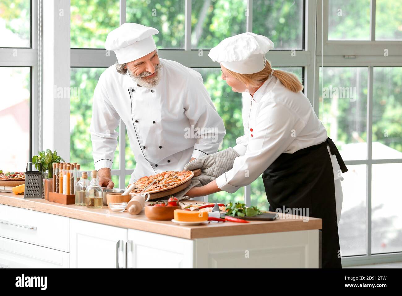 Mature italian woman cooking hi-res stock photography and images - Alamy