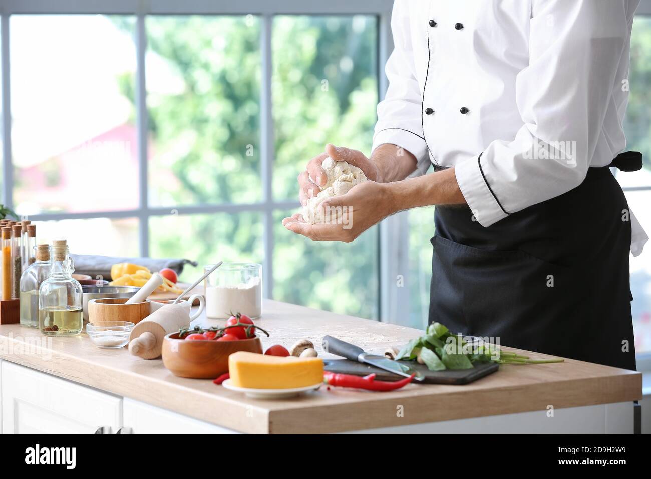 Mature chef cooking in kitchen Stock Photo - Alamy
