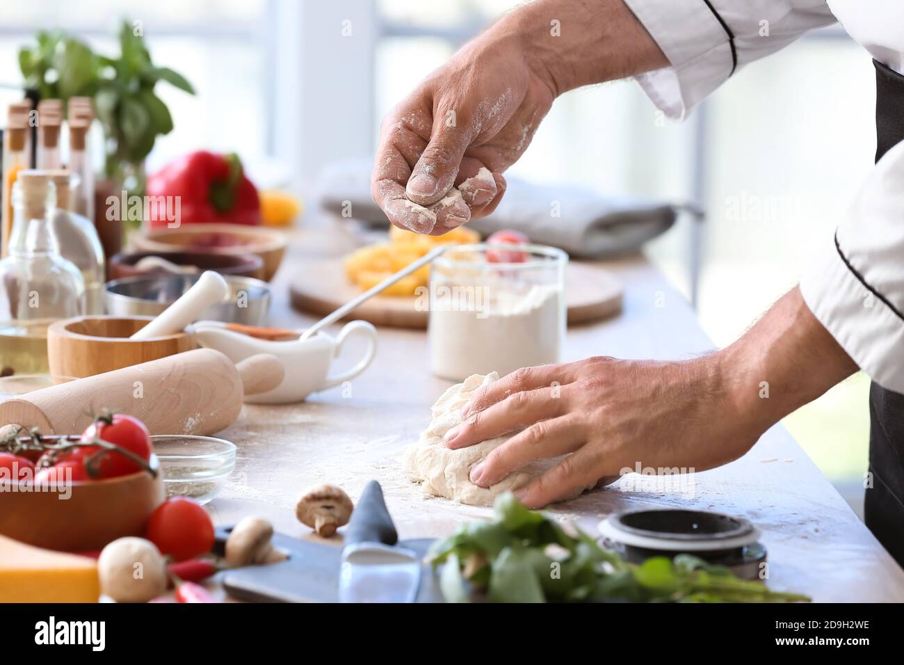 Mature chef cooking in kitchen, closeup Stock Photo - Alamy