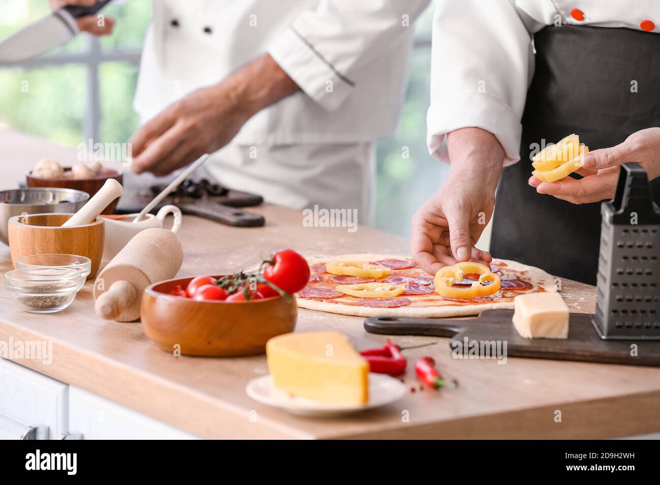 Chefs cooking tasty pizza hi-res stock photography and images - Alamy
