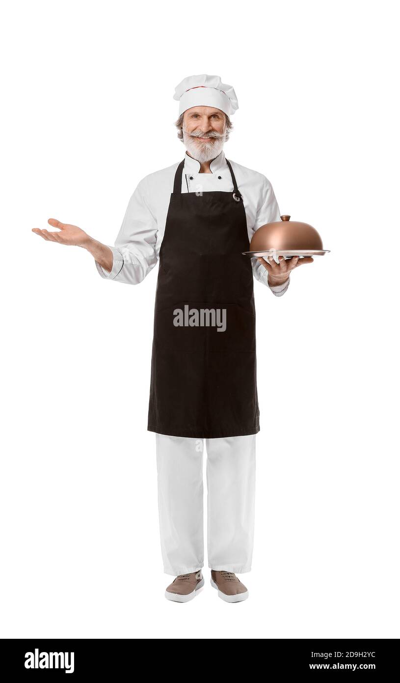 Mature male chef with tray and cloche on white background Stock Photo ...