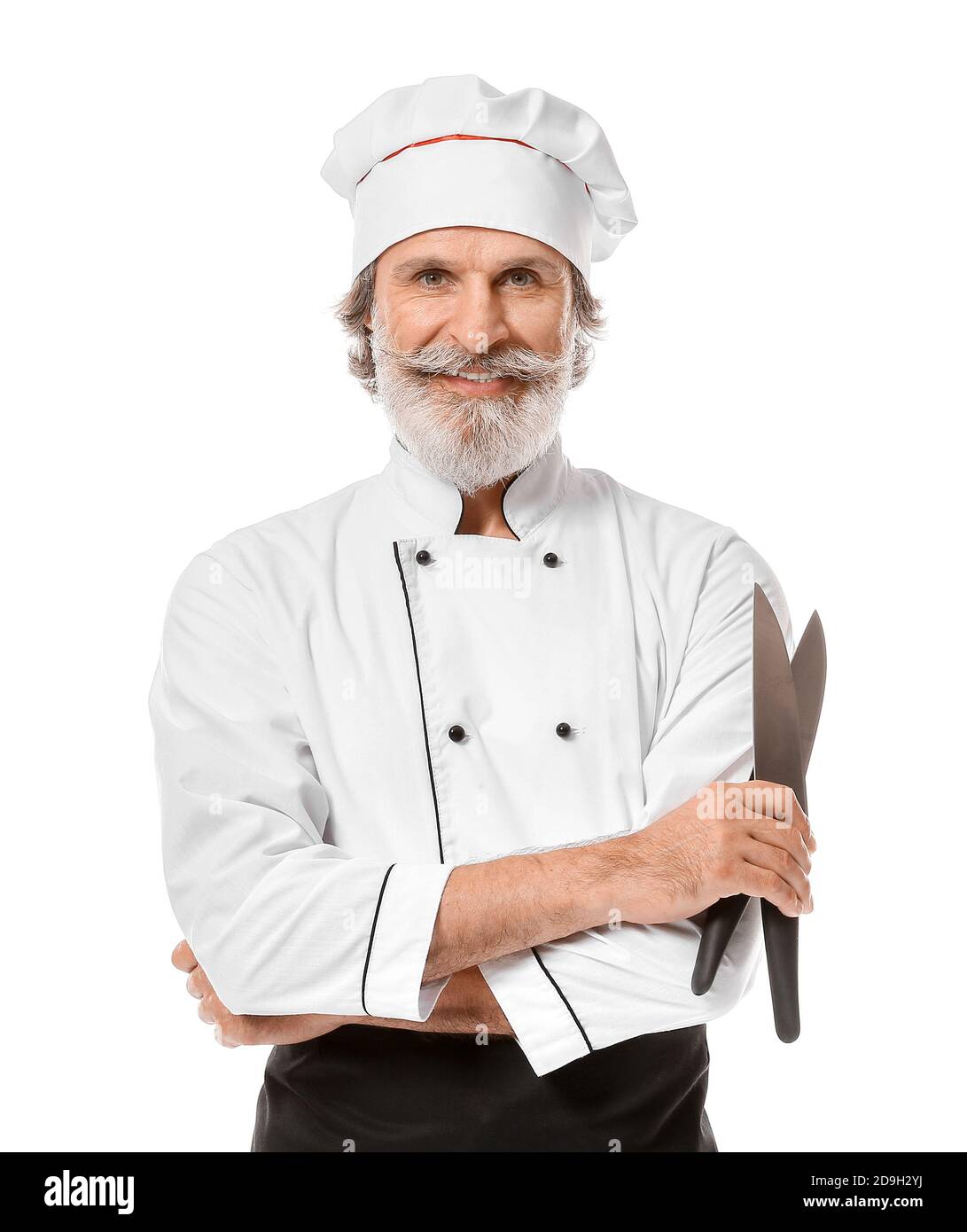 Mature male chef with knives on white background Stock Photo - Alamy