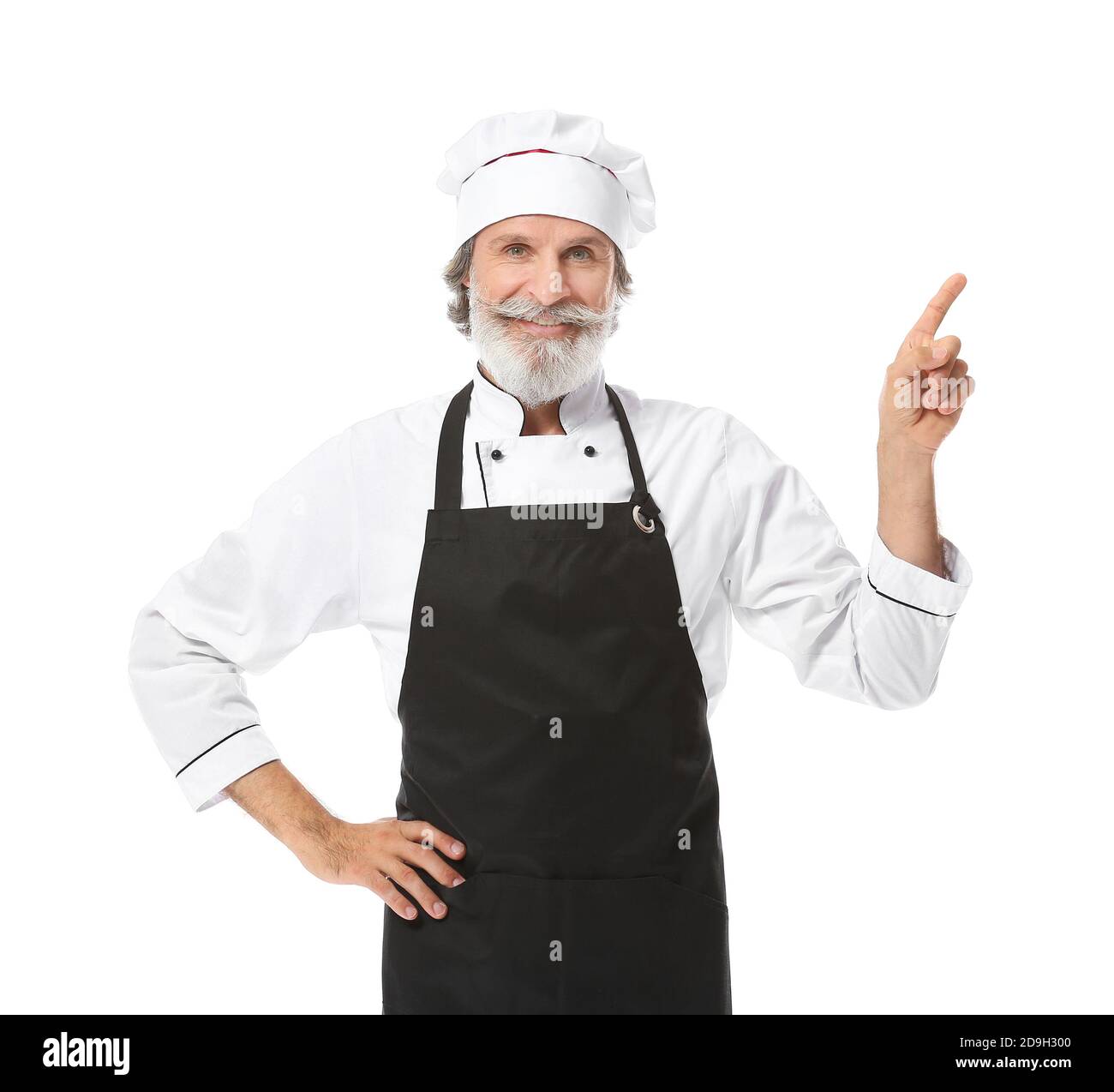 Mature male chef pointing at something on white background Stock Photo ...