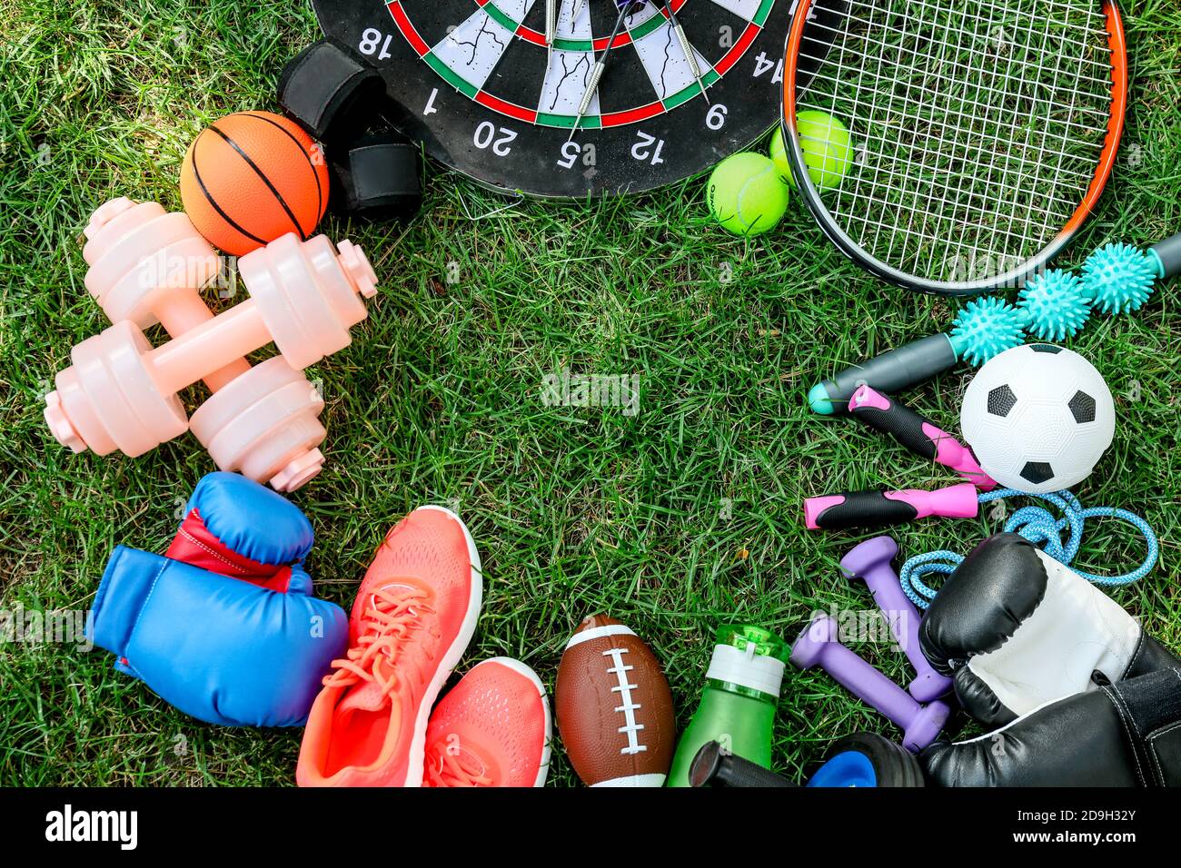 Frame made of sport equipment on green grass Stock Photo - Alamy