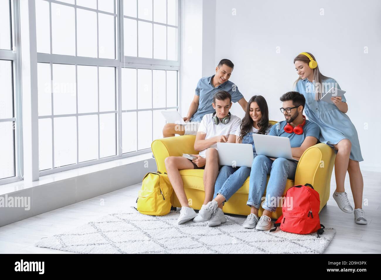 Students with modern devices studying online indoors Stock Photo - Alamy