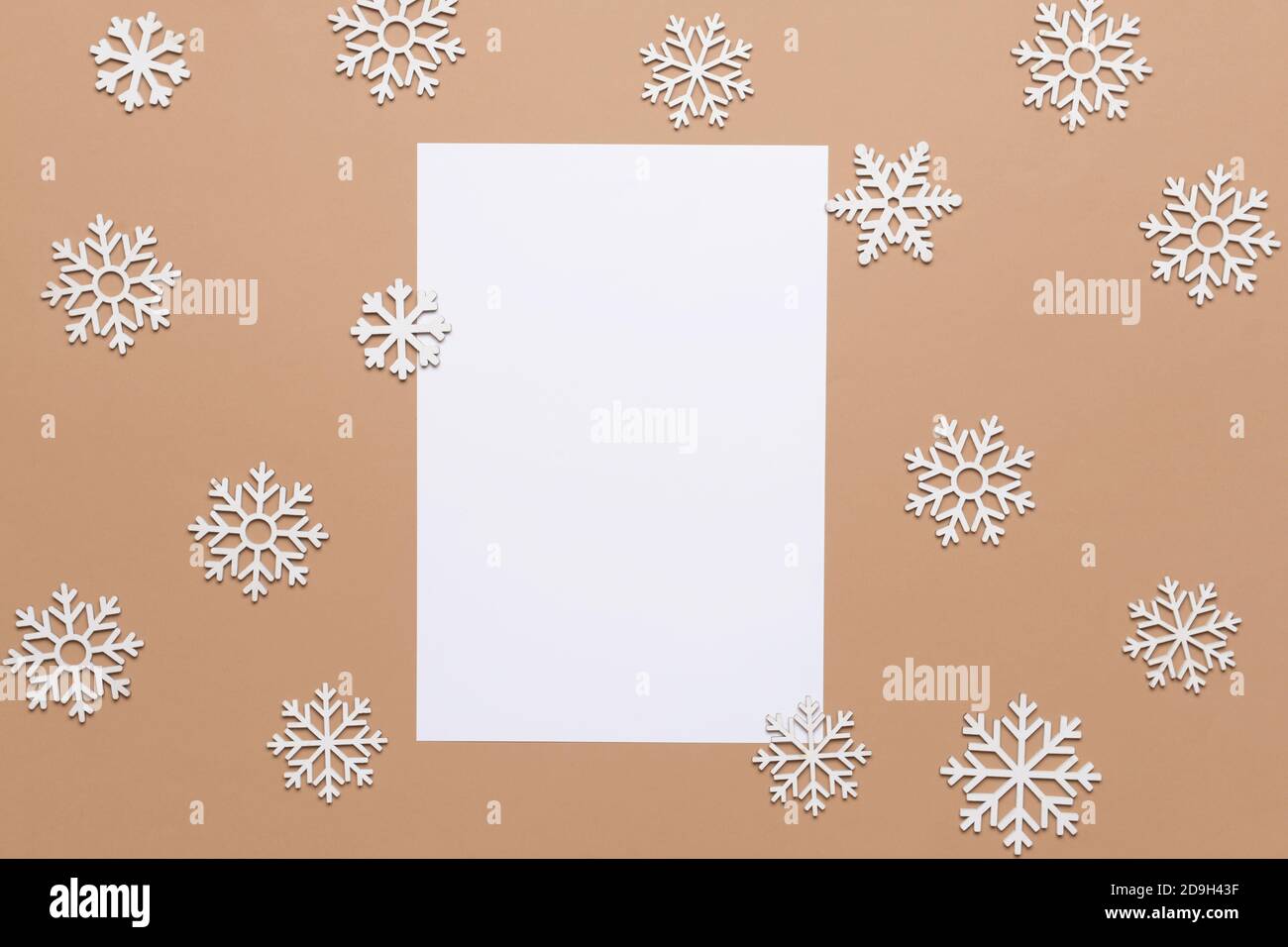 Beautiful snowflakes with empty card on color background Stock Photo ...