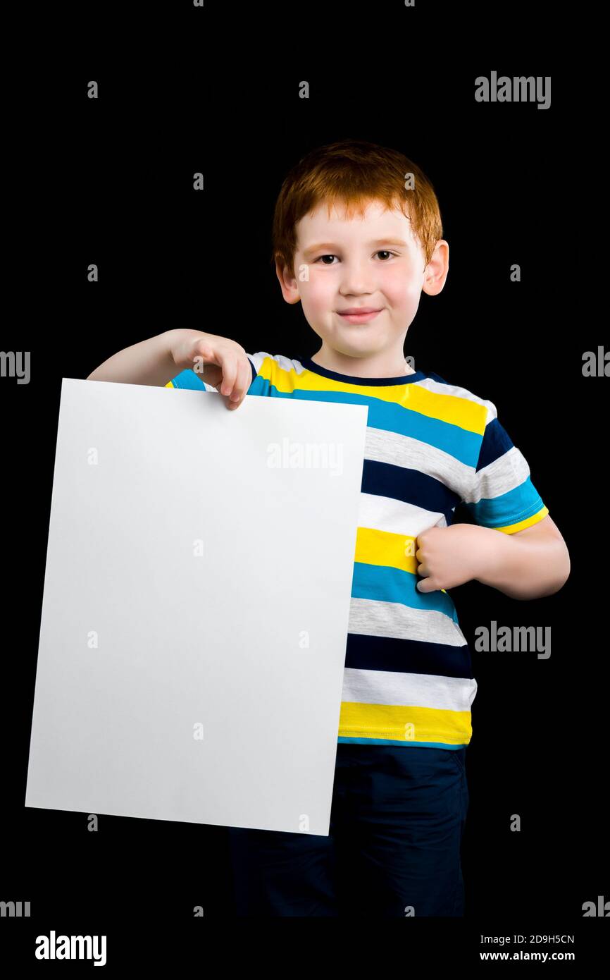 a beautiful boy holds paper Stock Photo - Alamy