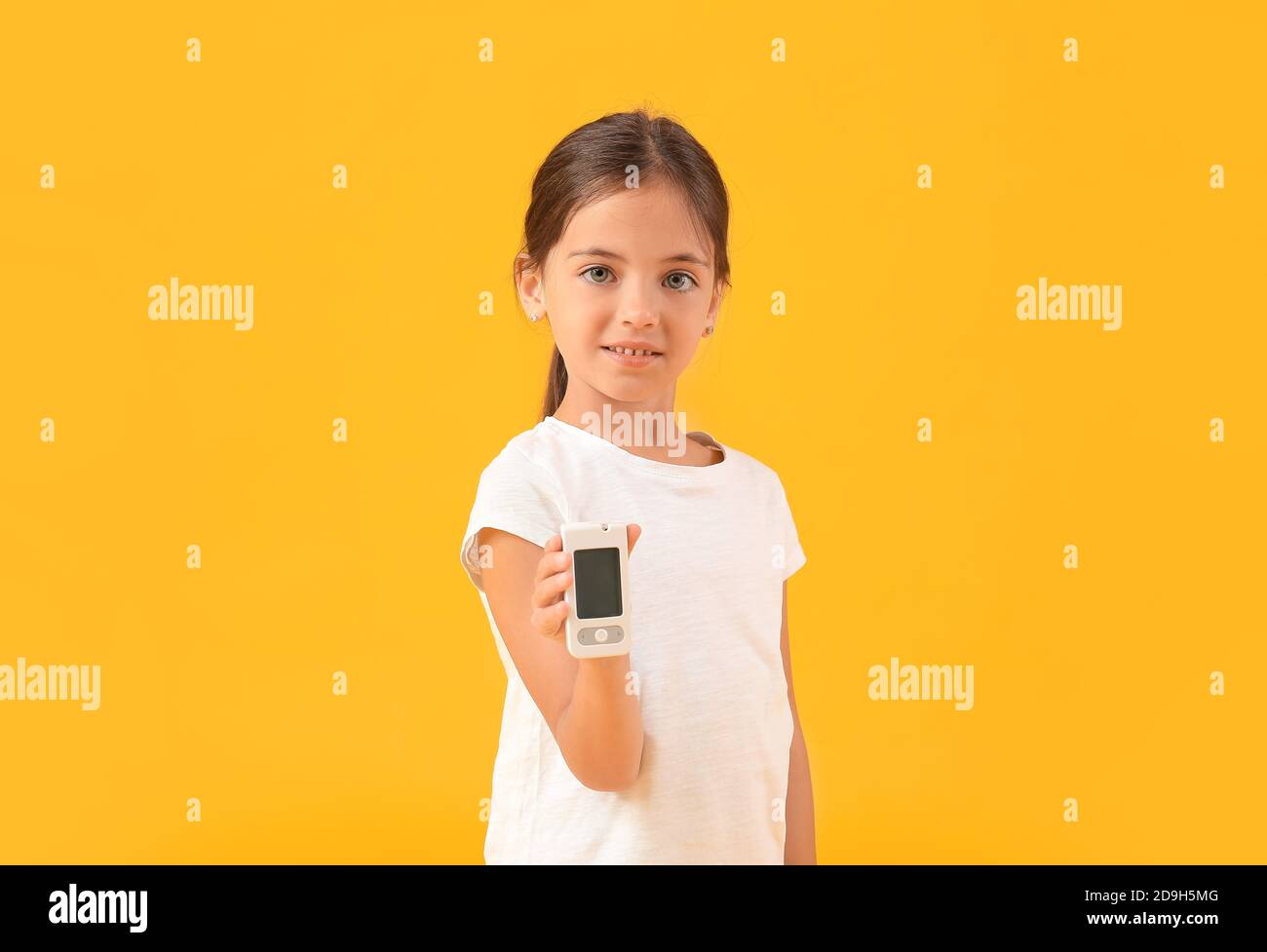 Little diabetic girl with glucometer on color background Stock Photo ...