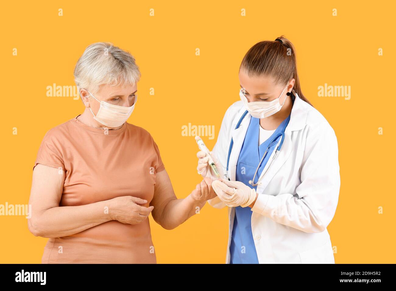 Woman giving blood sample doctor hi-res stock photography and images ...