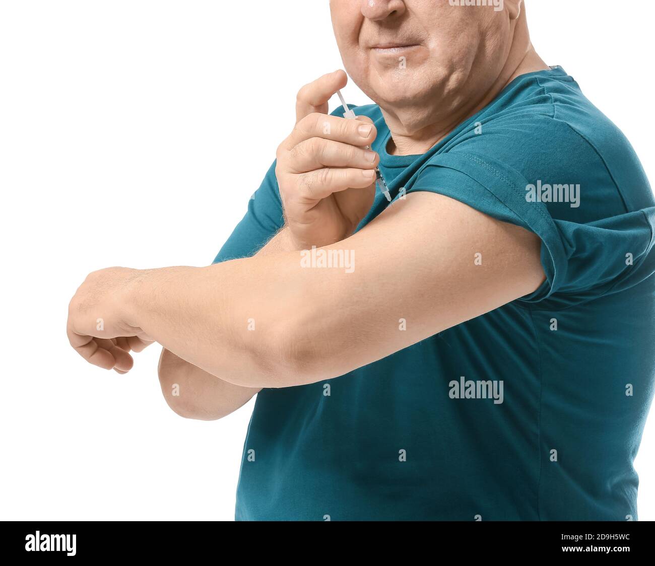 Senior diabetic man giving himself insulin injection on white ...