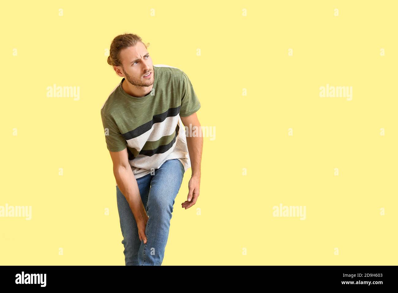 Man with problem of limbs numbness on color background. Diabetes ...