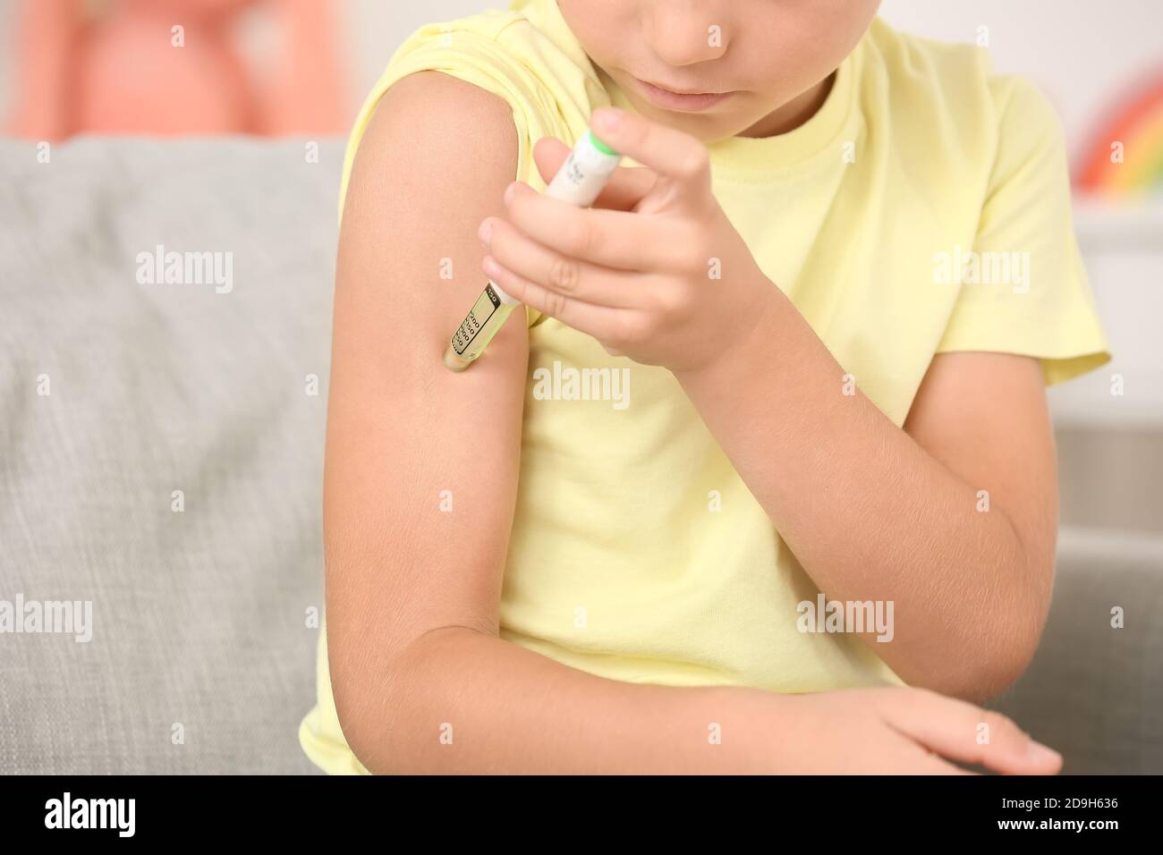 Little diabetic boy giving himself insulin injection at home Stock ...