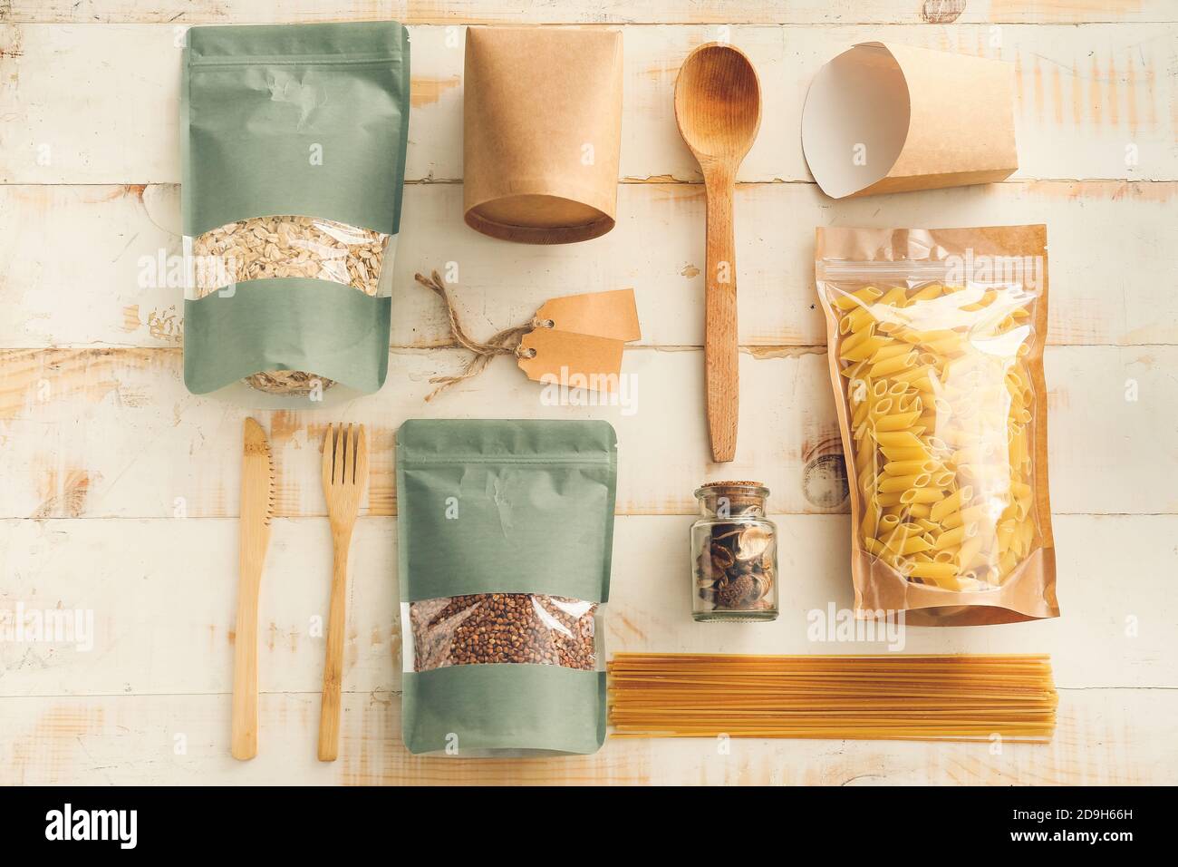 Packages for food on white wooden background Stock Photo - Alamy