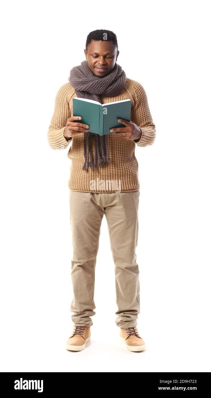 African-American man reading book on white background Stock Photo - Alamy