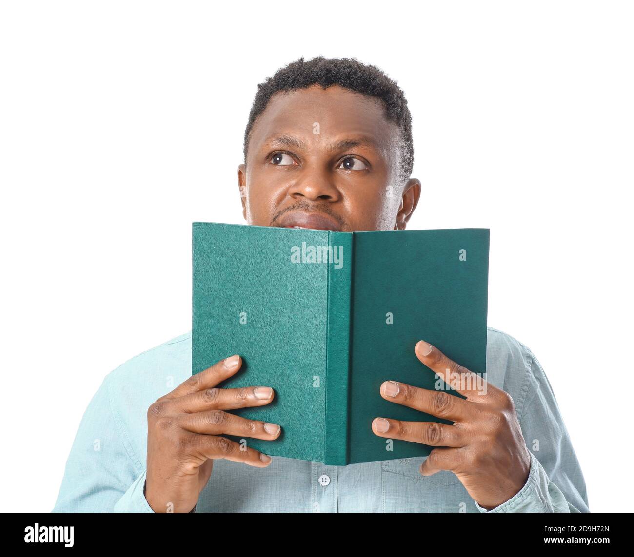 African-American man reading book on white background Stock Photo - Alamy