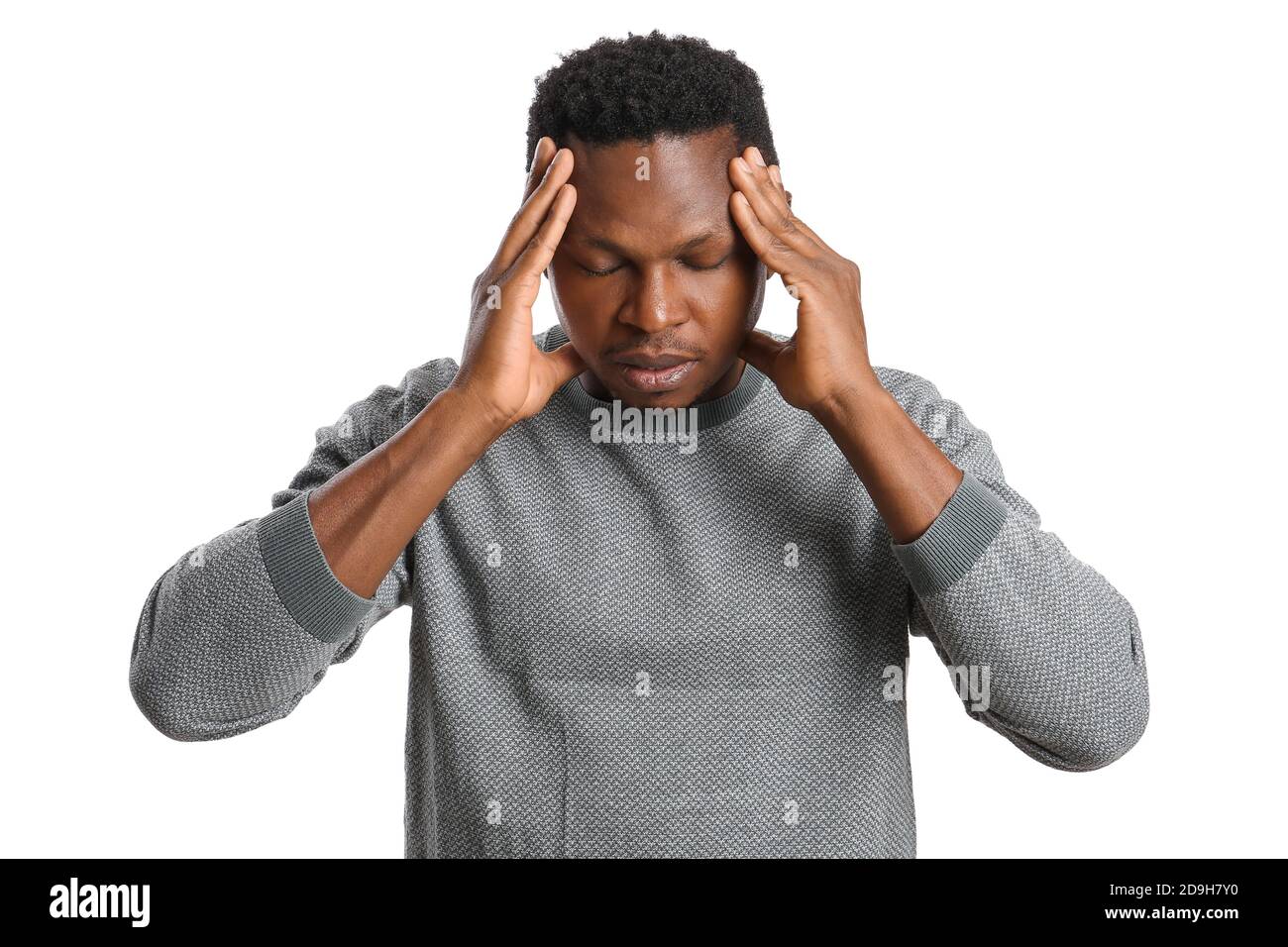 Stressed African-American man on white background Stock Photo - Alamy