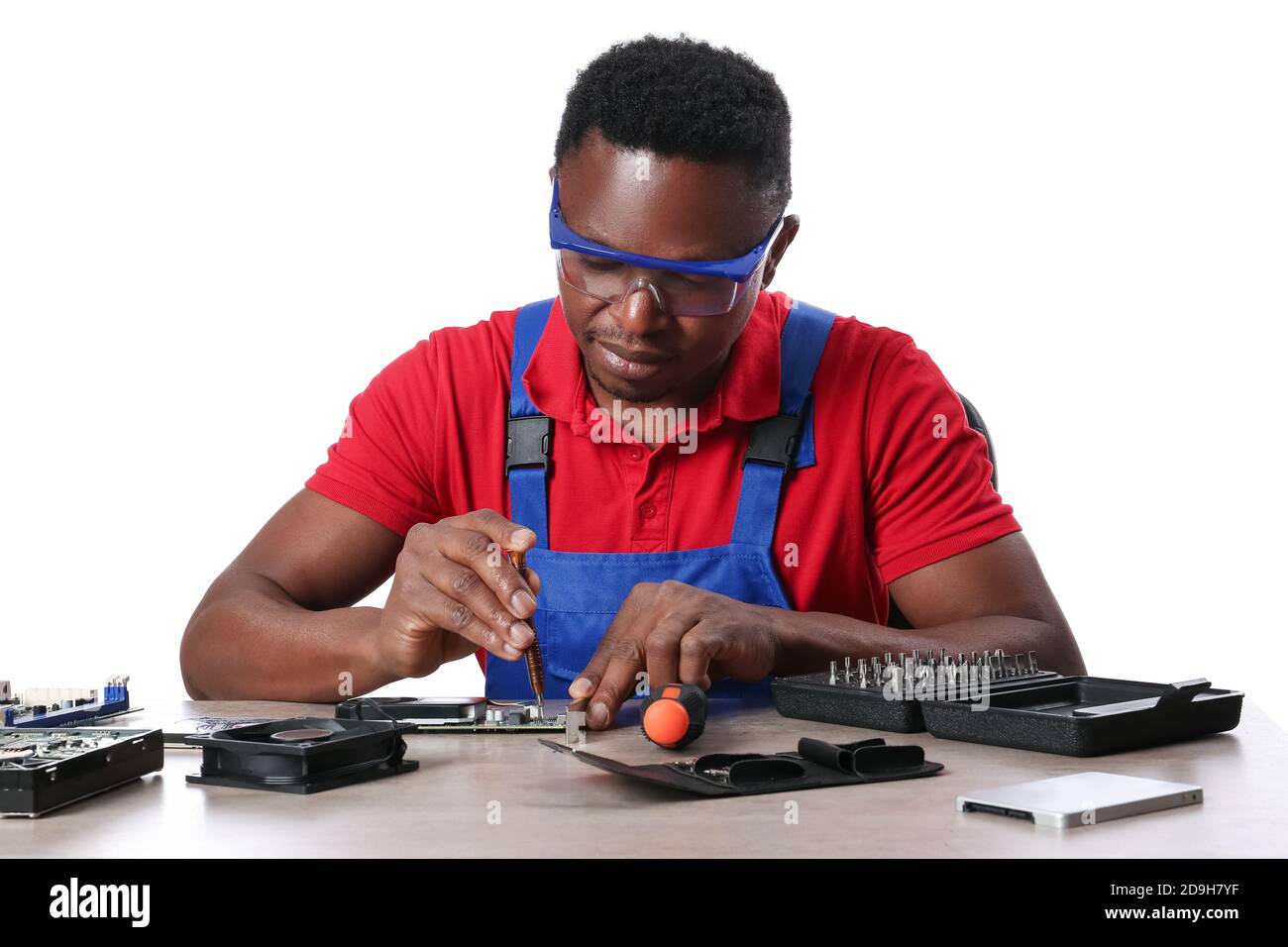 African-American technician repairing computer on white background ...