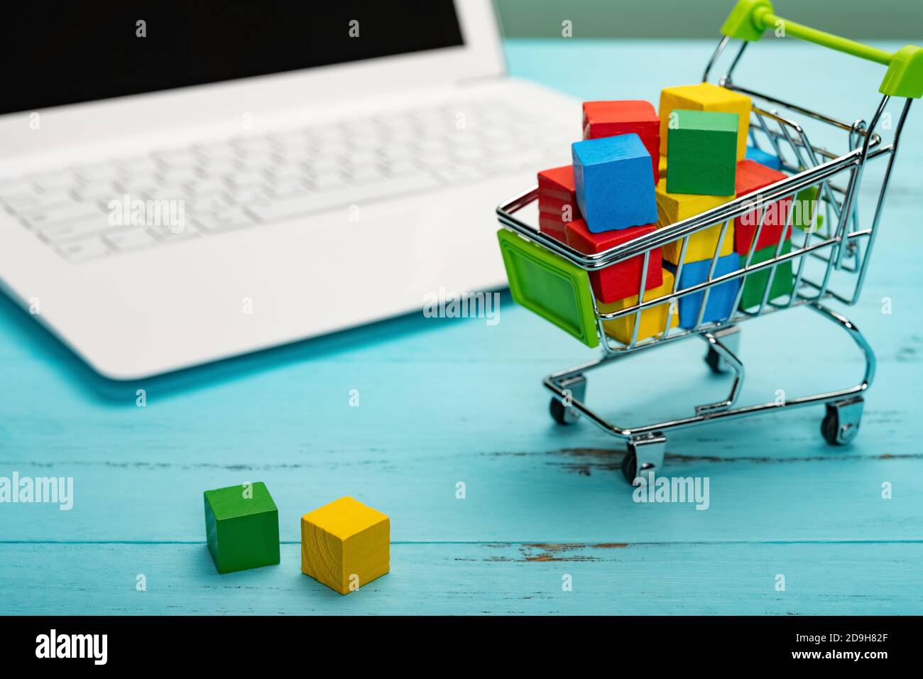 full filled shopping cart with a laptop Stock Photo - Alamy