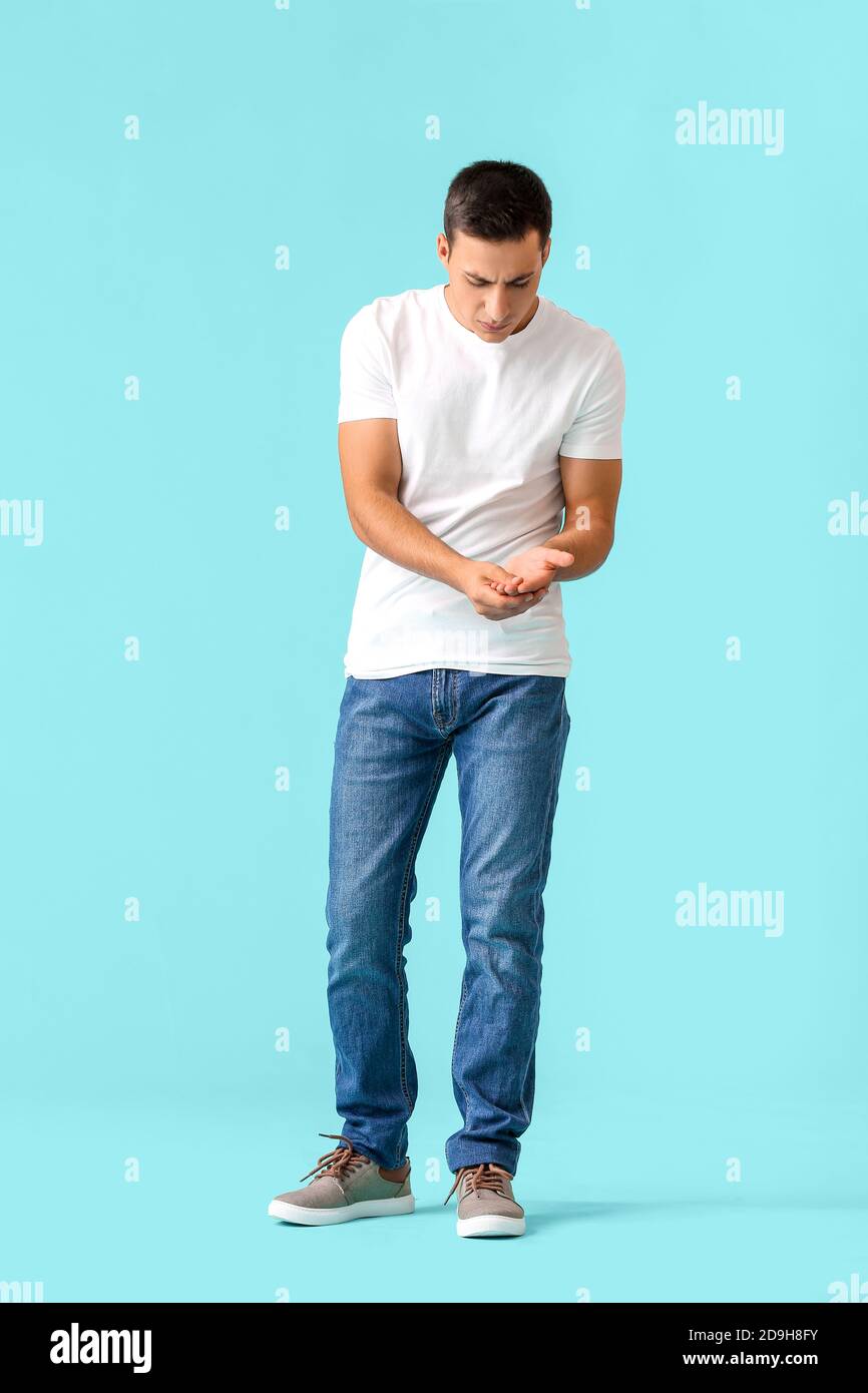 Man with problem of limbs numbness on color background. Diabetes ...