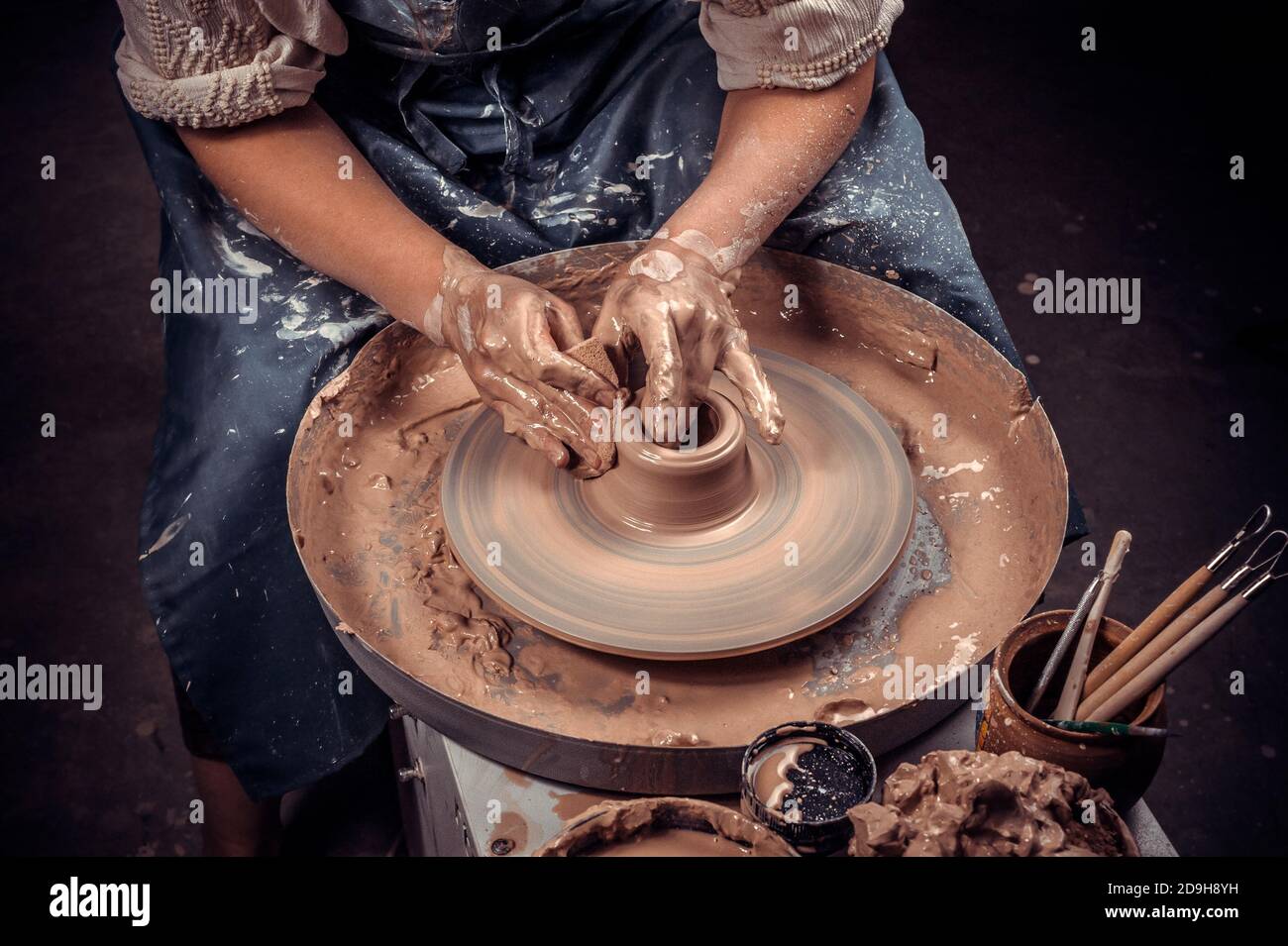 Ceramist master is working on pottery wheel. Artisan production. Close ...