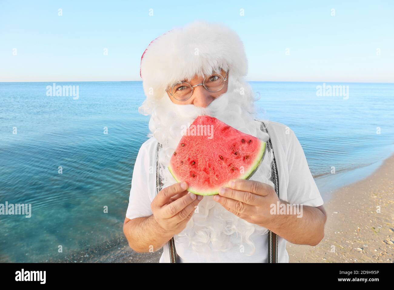 Santa Claus with watermelon at sea resort. Christmas vacation Stock ...