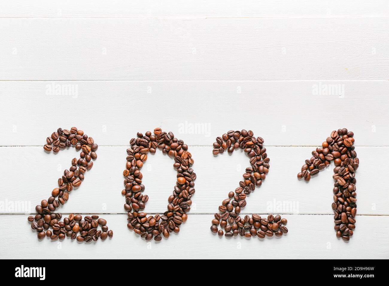 Figure 2021 made of coffee beans on white wooden background Stock Photo ...