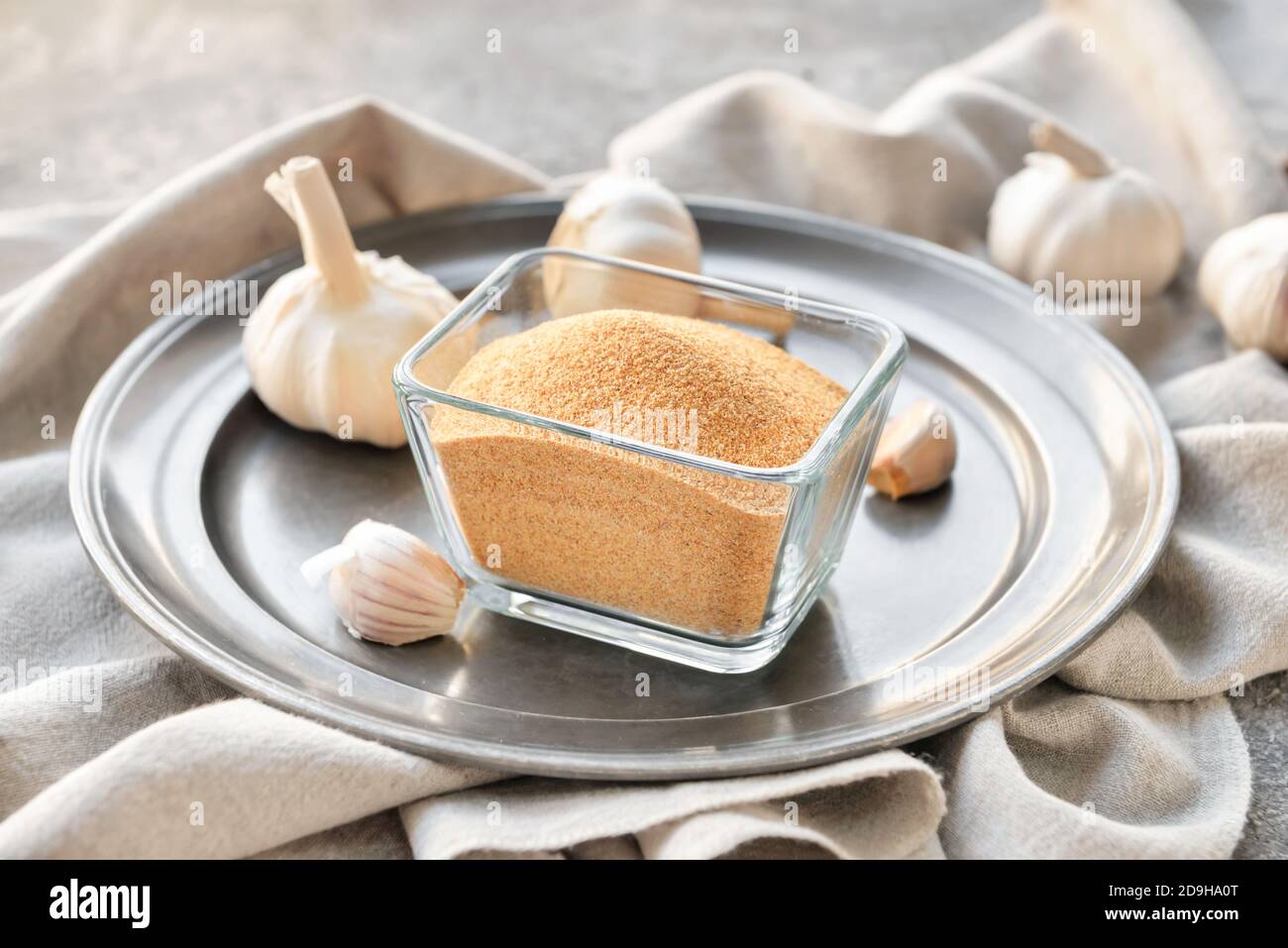 Bowl with aromatic powdered garlic on table Stock Photo - Alamy