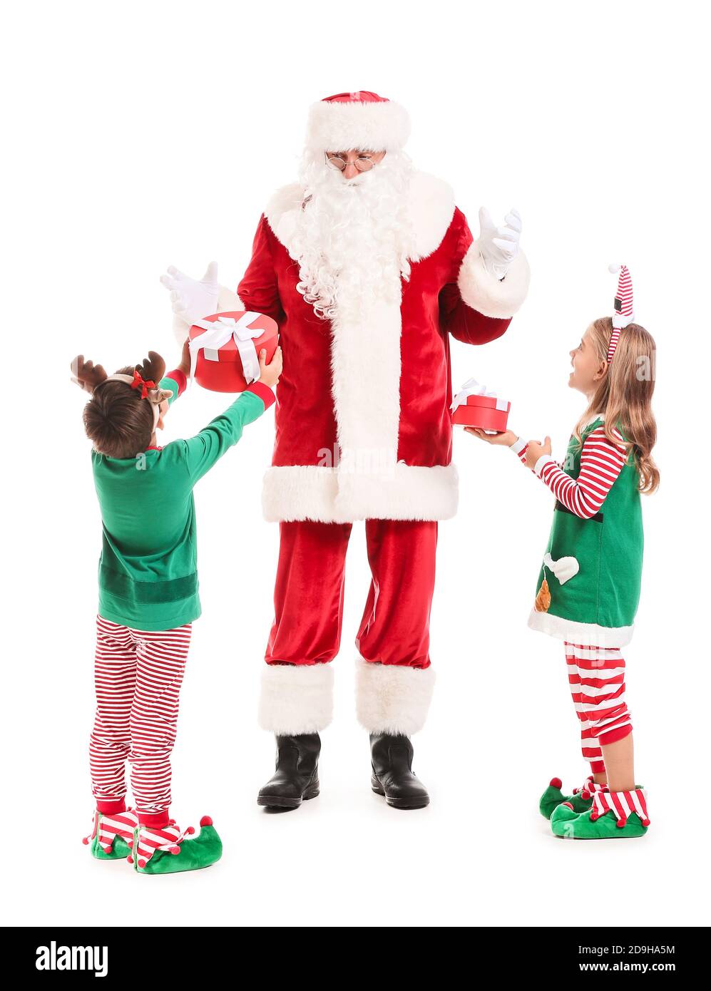 Cute little elves greeting Santa Claus on white background Stock Photo ...