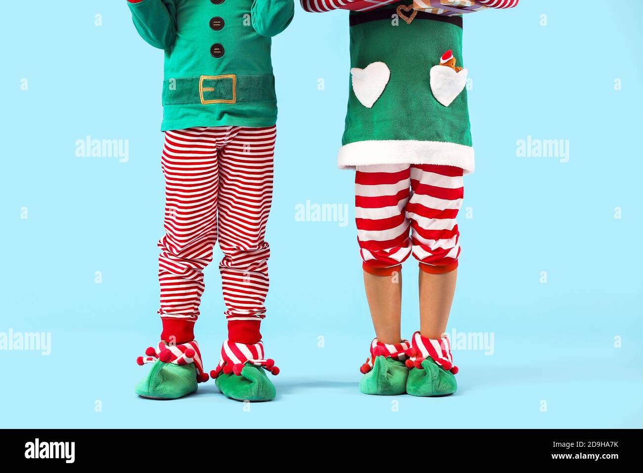 Cute little elves on color background Stock Photo - Alamy