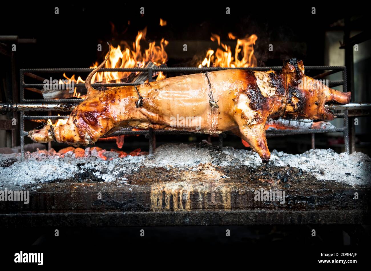 Pig cooking over open fire hi-res stock photography and images - Alamy