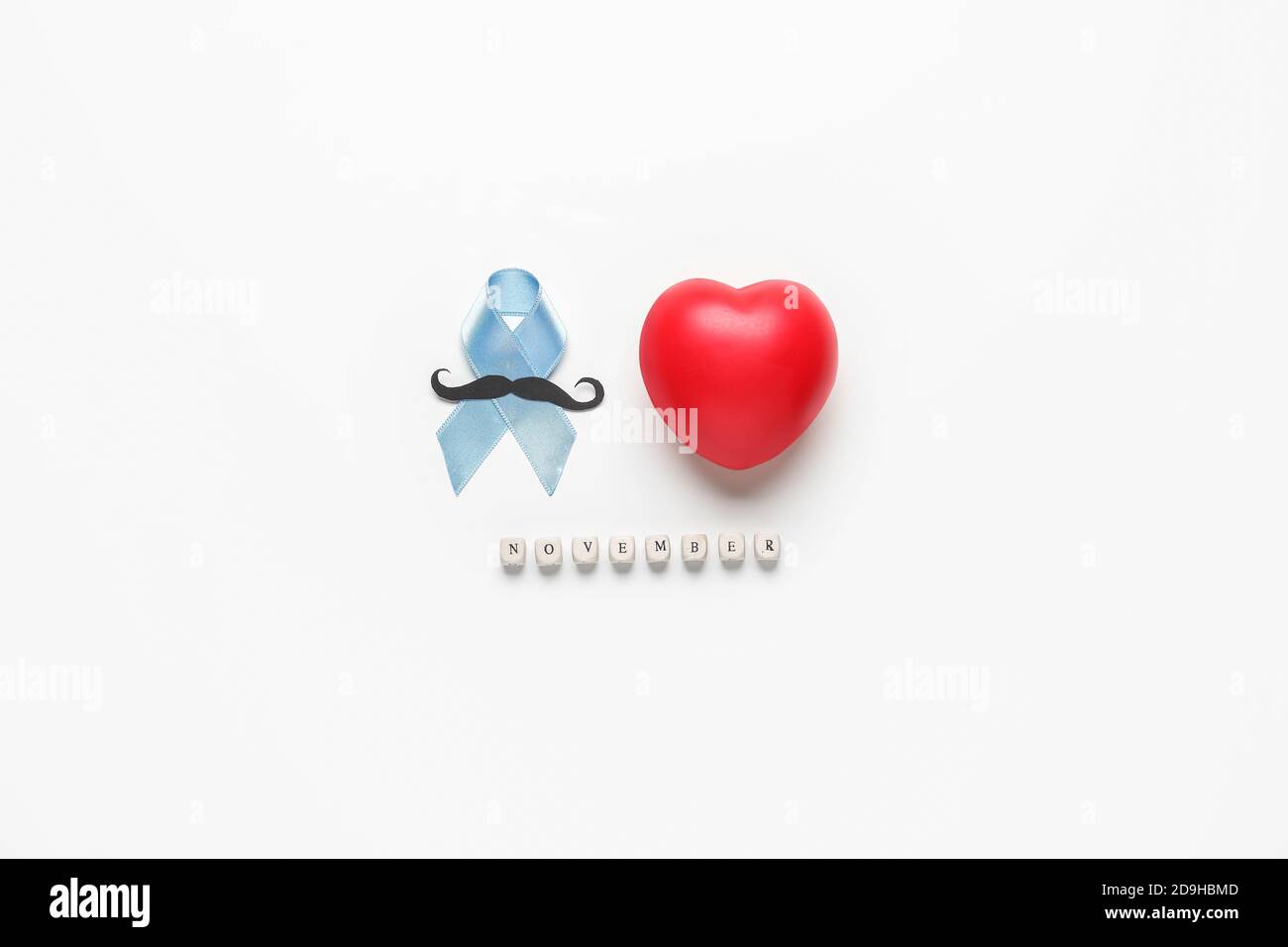 Heart with blue ribbon, mustache and word NOVEMBER on white background ...