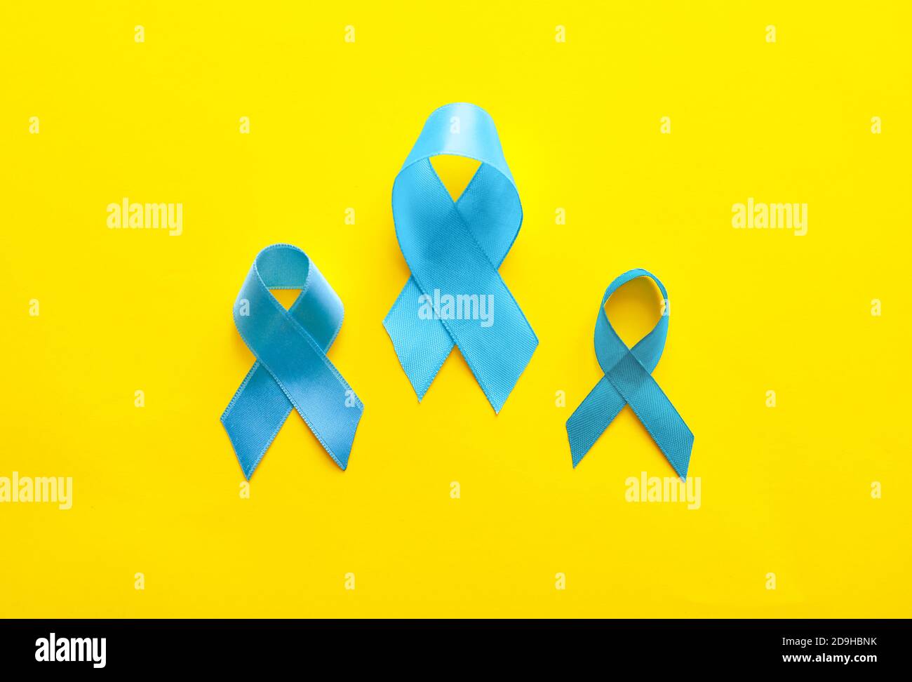 Blue ribbons on color background. Prostate cancer awareness concept ...