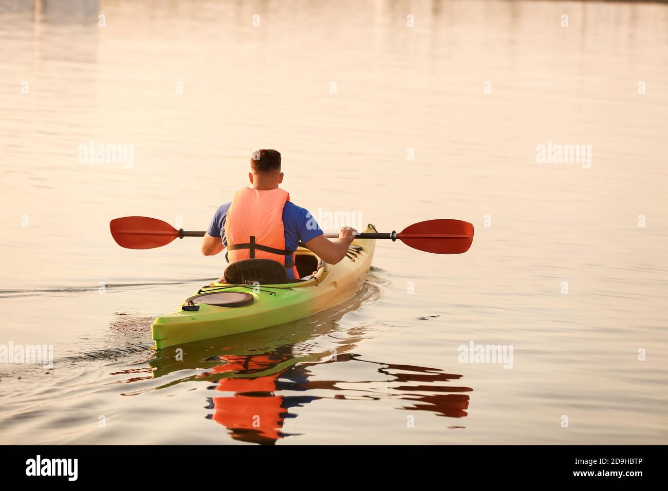 Young man kayaking in river Stock Photo - Alamy