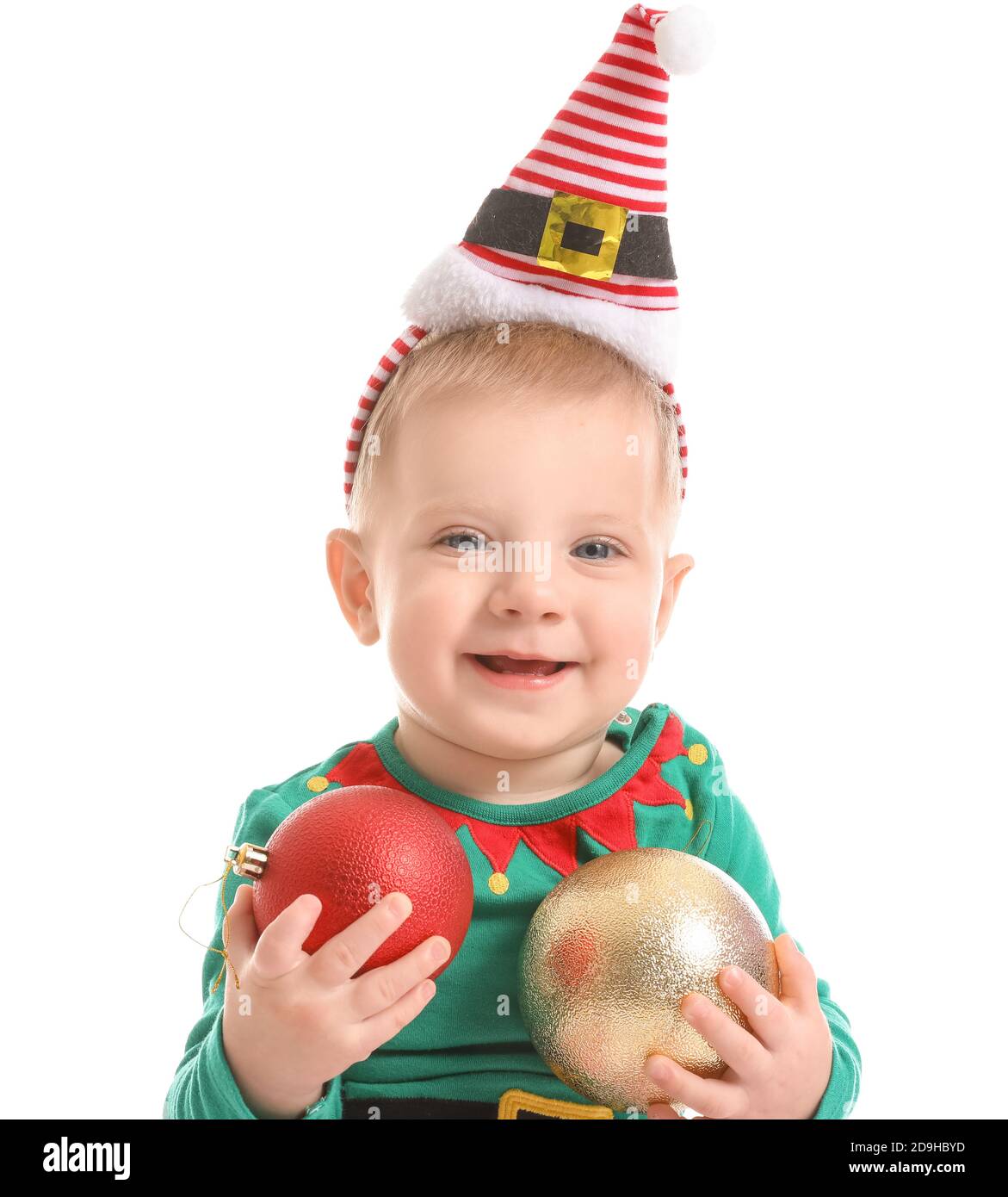 Cute little baby in Christmas elf costume on white background Stock ...