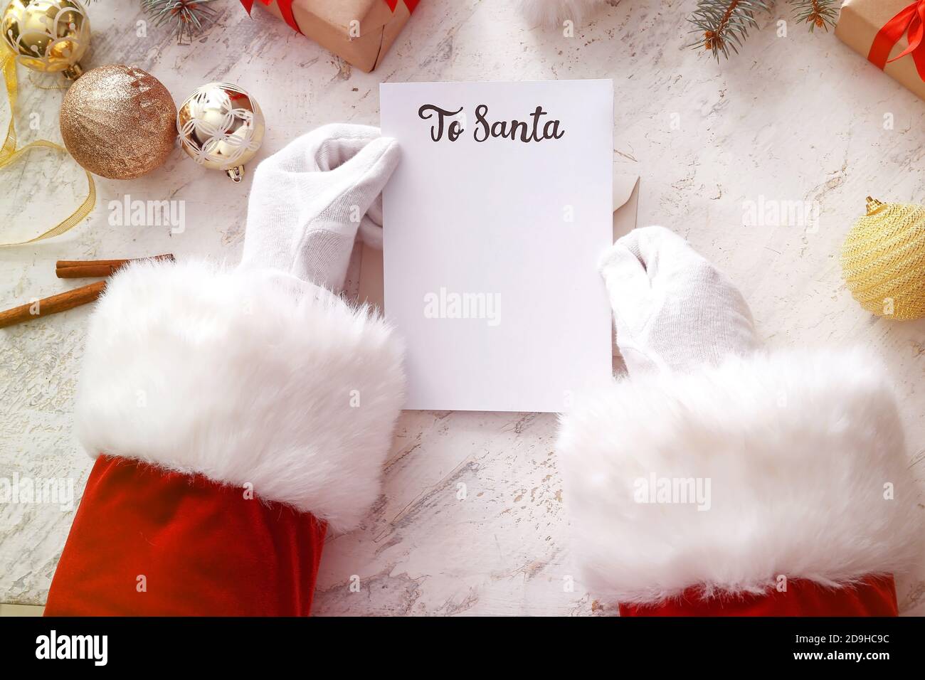 Santa with letter and Christmas decor on white background Stock Photo ...