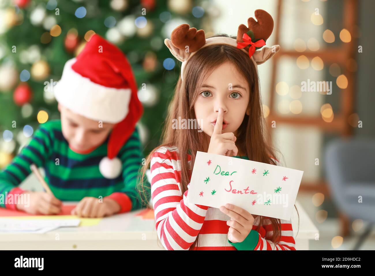 Little children writing letters to Santa at home on Christmas eve Stock ...