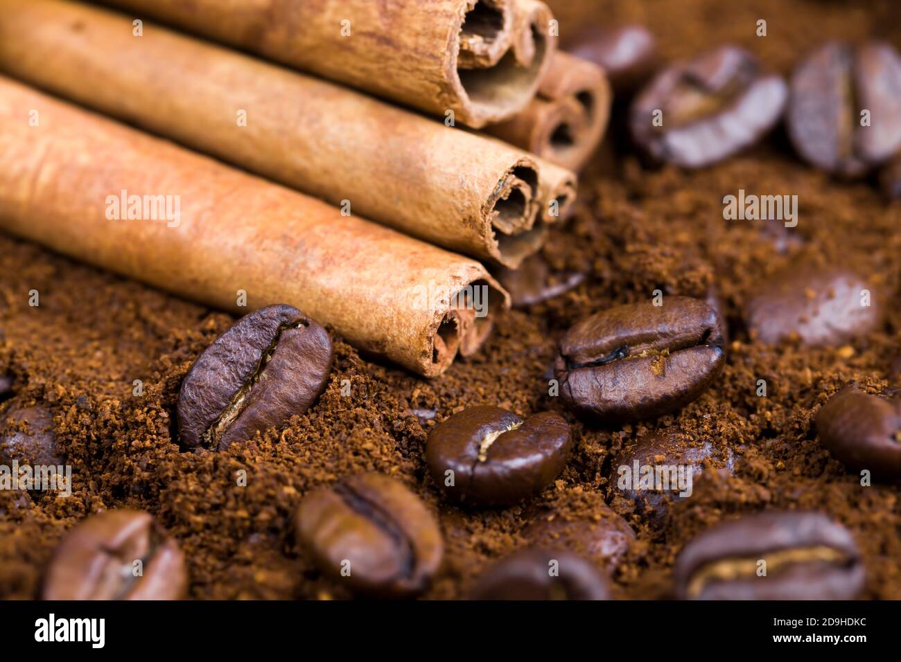 aromatic coffee beans with ground coffee powder Stock Photo - Alamy