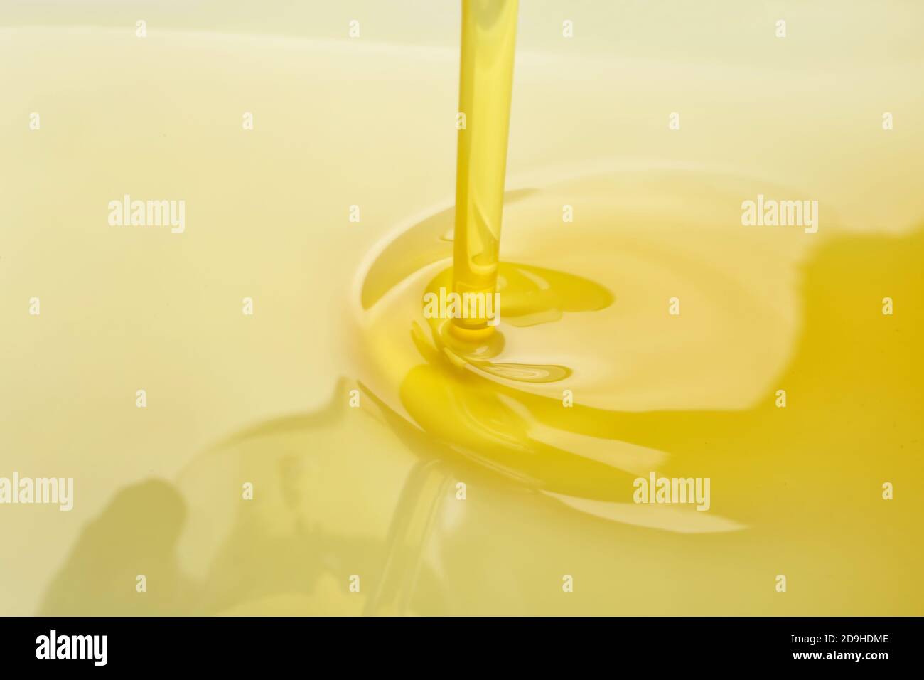 Pouring of olive oil, closeup view Stock Photo - Alamy